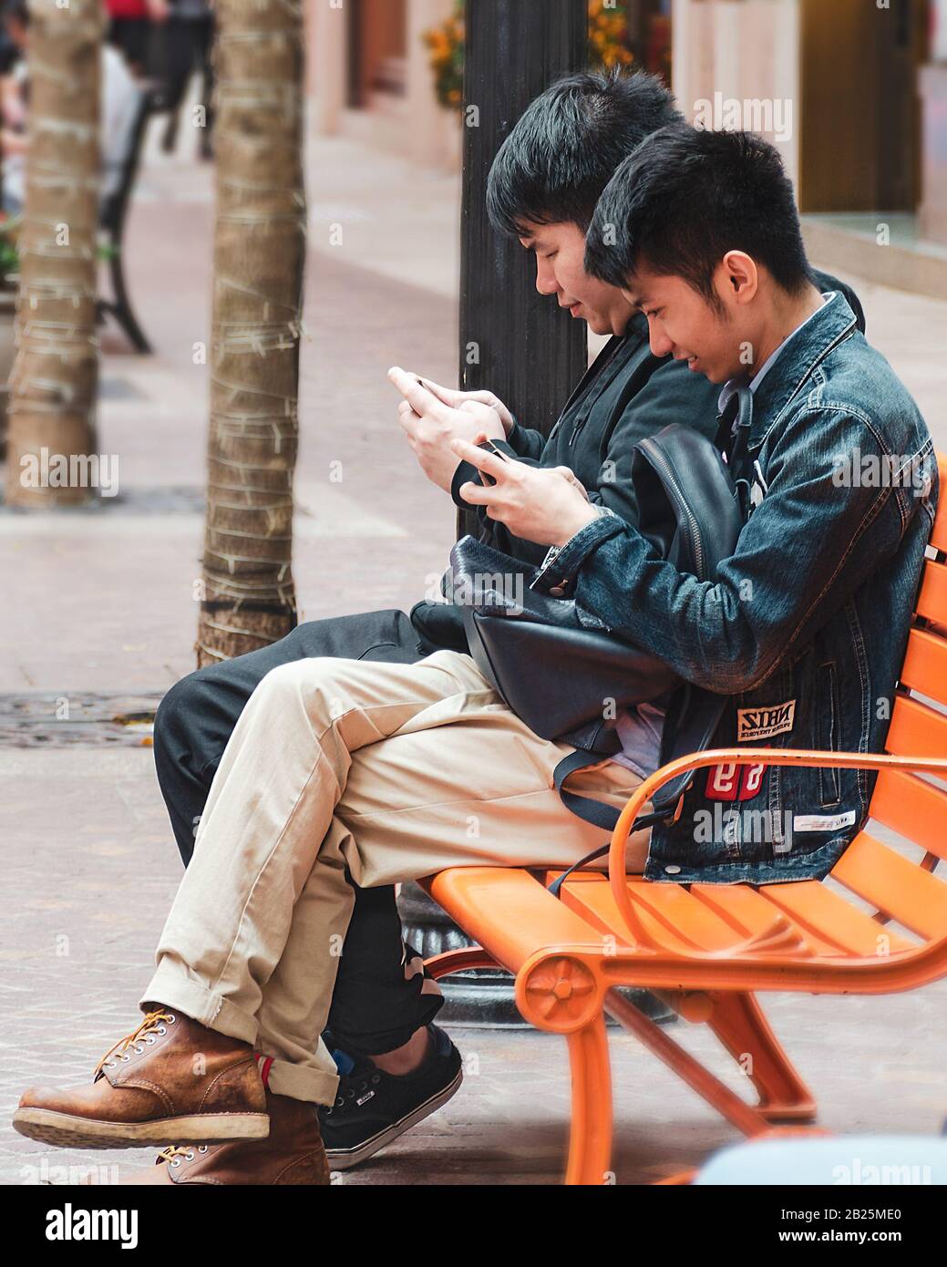 Generation z man using cell phone hi-res stock photography and images ...