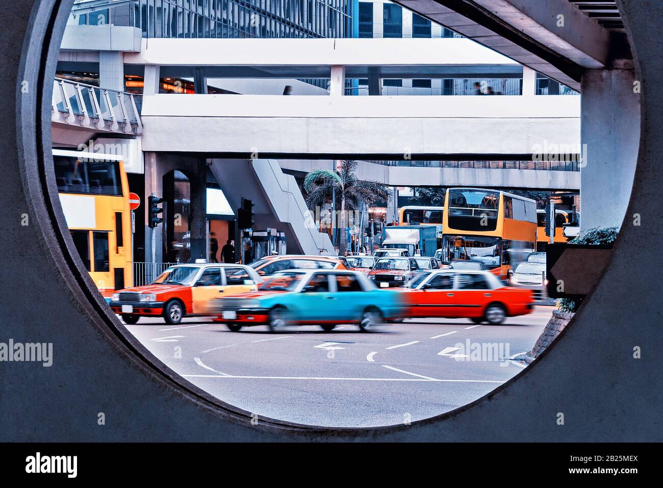 A lot of cars at the city street. View through a round frame on Hong ...