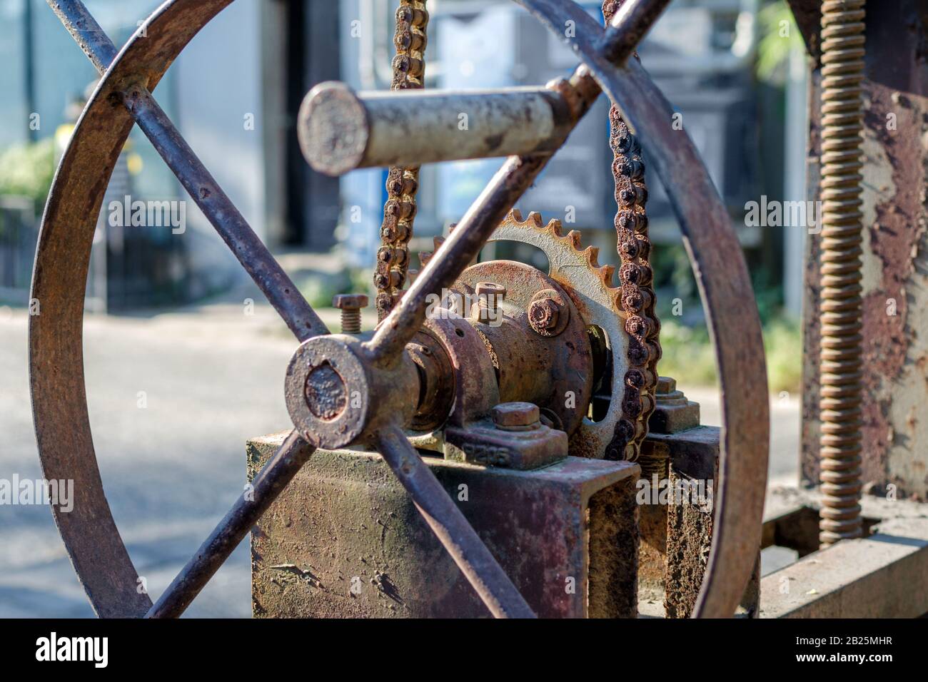 Old rusty lifting mechanism with a cogwheel. Rusty mechanism Stock ...