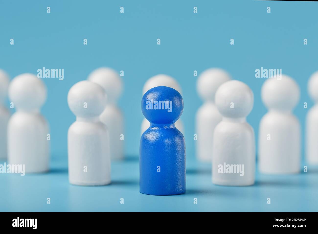 Blue leader the leader leads a group of employees in white to achieve ...