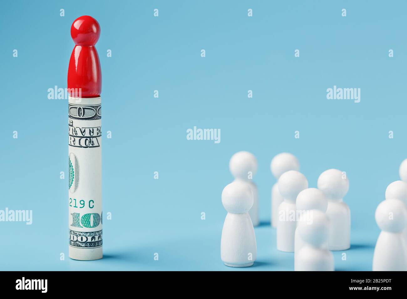 A red man stands on money dollars and manages a crowd of white people ...