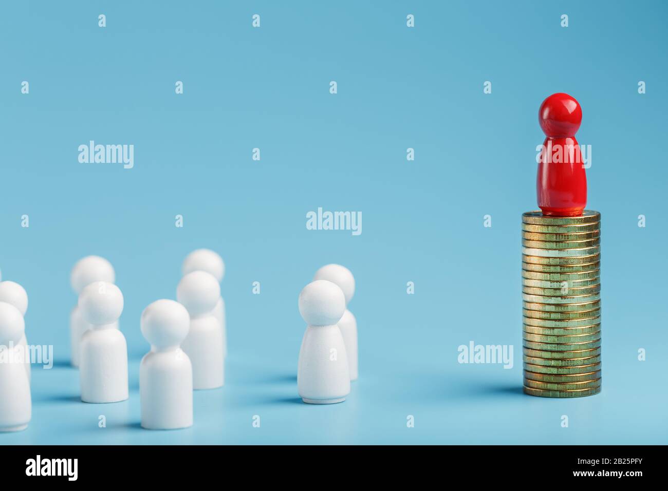 The red man stands on money and gold coins and controls a crowd of ...