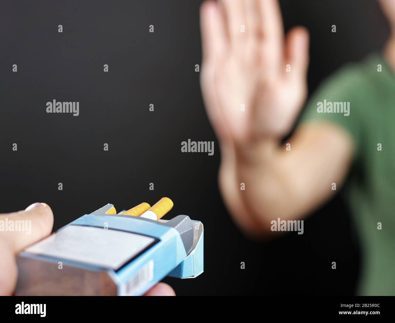 hand girl holds a pack of cigarettes suggests making a choice. offer ...