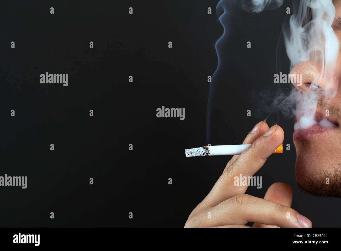 Blowing smoke in face hi-res stock photography and images - Alamy