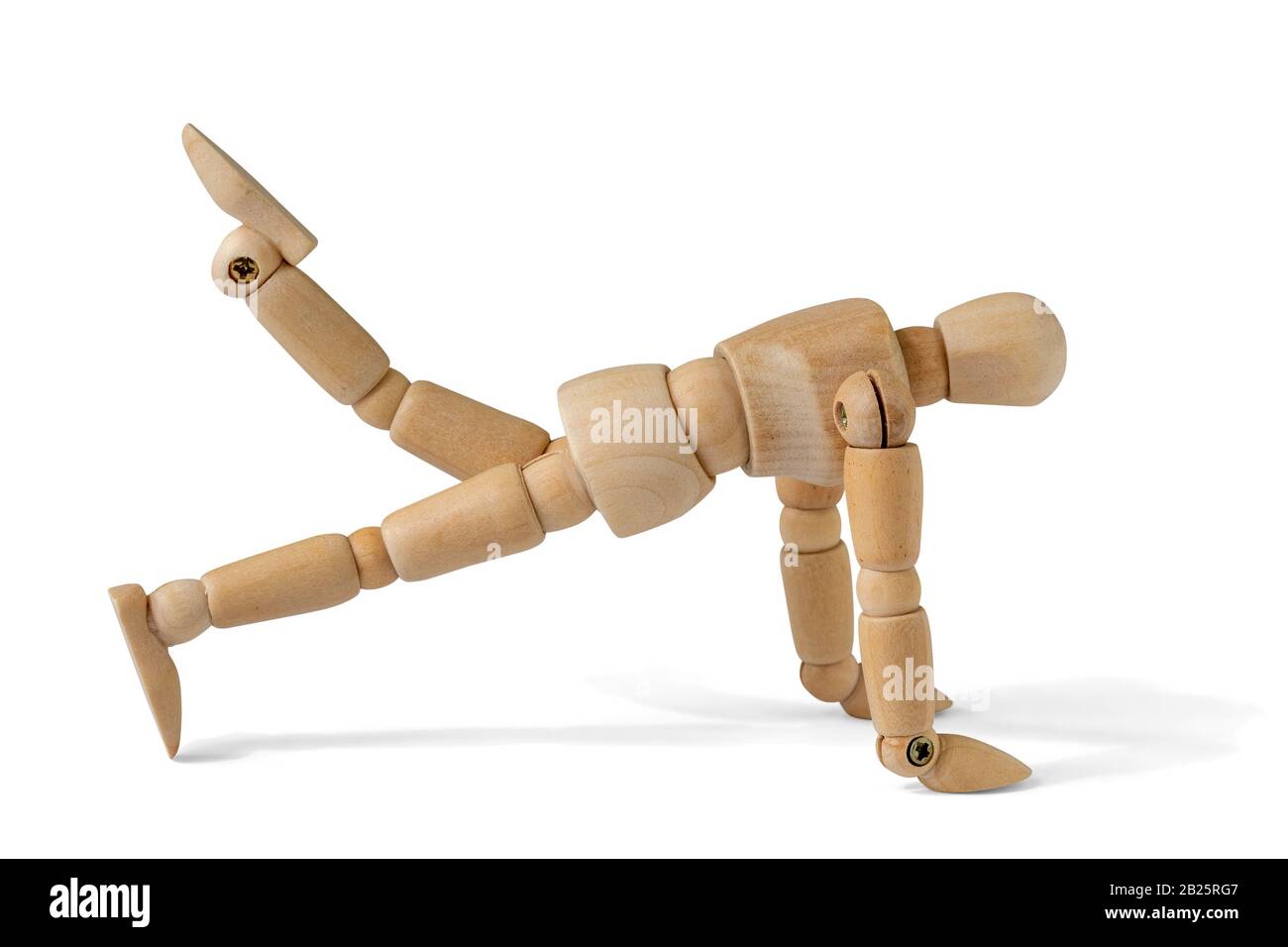 Wooden man doing fitness exercises , isolated on white background Stock ...