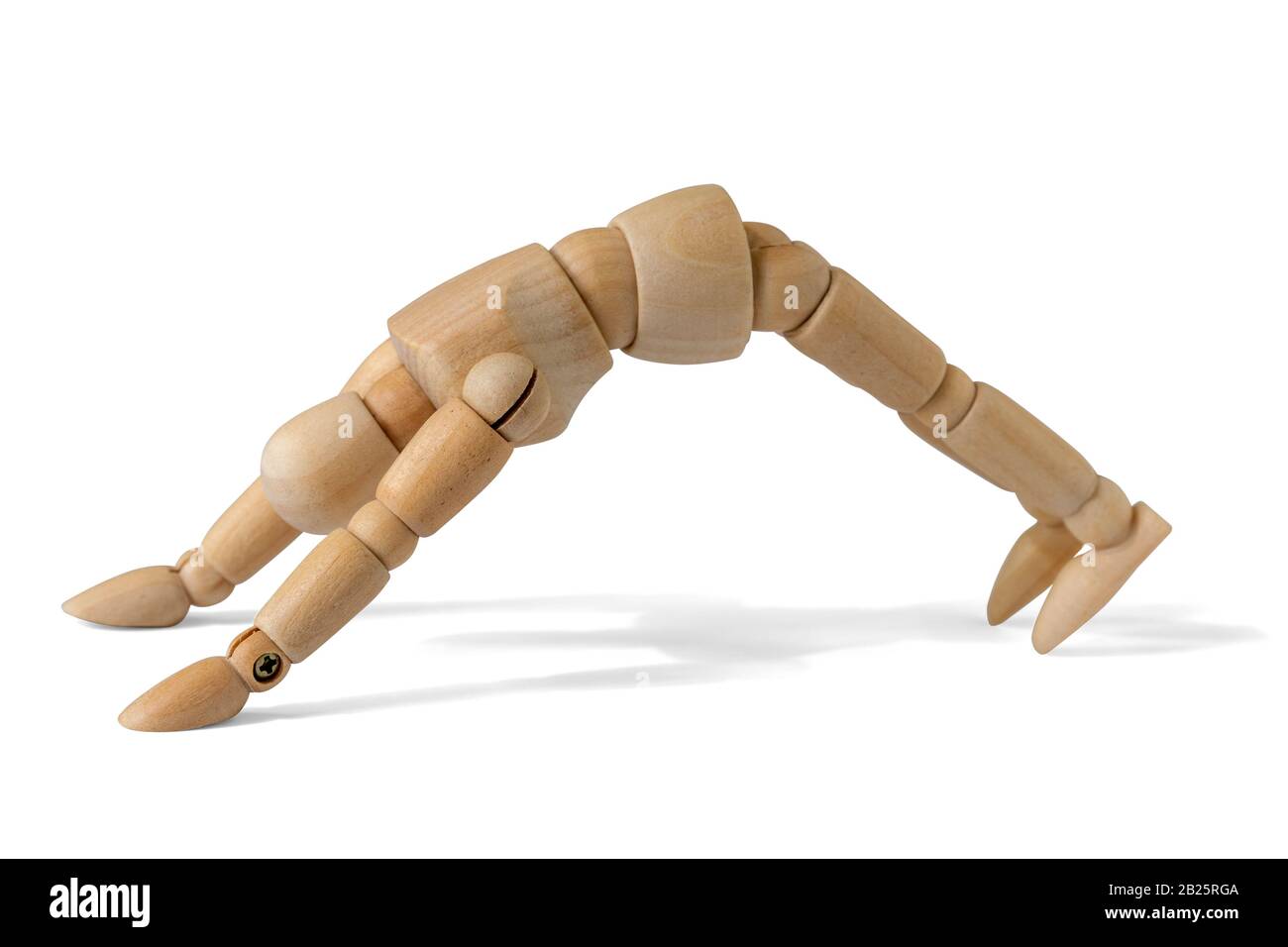 Wooden man doing gymnastic exercises , isolated on white background ...
