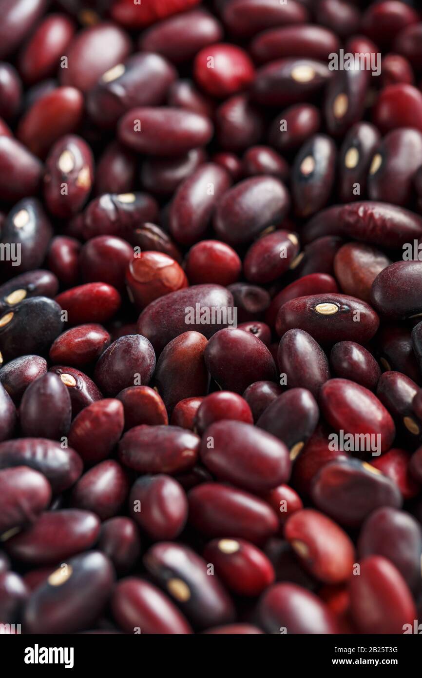 Closeup of a grain of red bean seeds. The texture of the legumes. Close ...