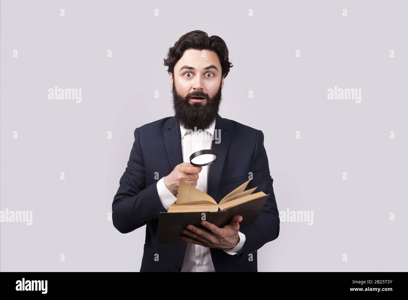 Man reading book shocked expression hi-res stock photography and images ...
