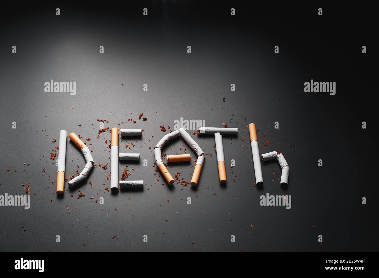 The inscription DEATH from cigarettes on a black background. Stop ...
