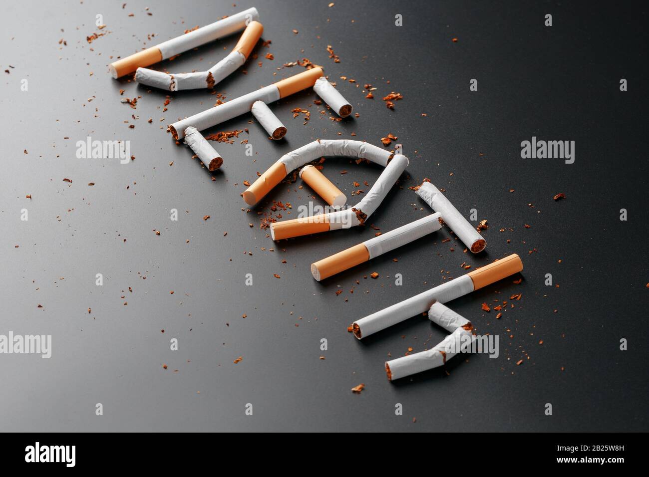 The inscription DEATH from cigarettes on a black background. Stop ...