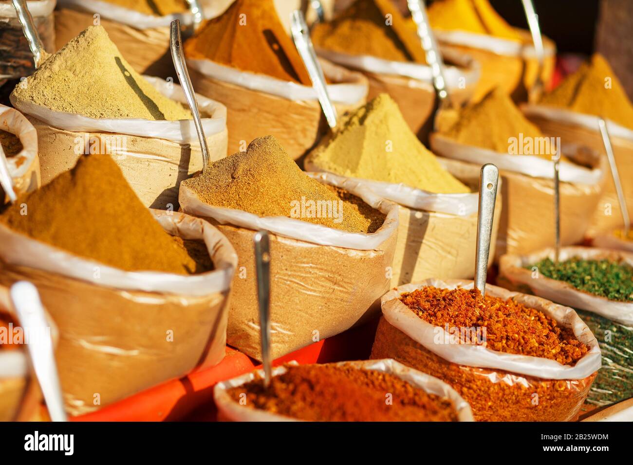 Colorful spices in bags at a market in Goa, India Stock Photo - Alamy
