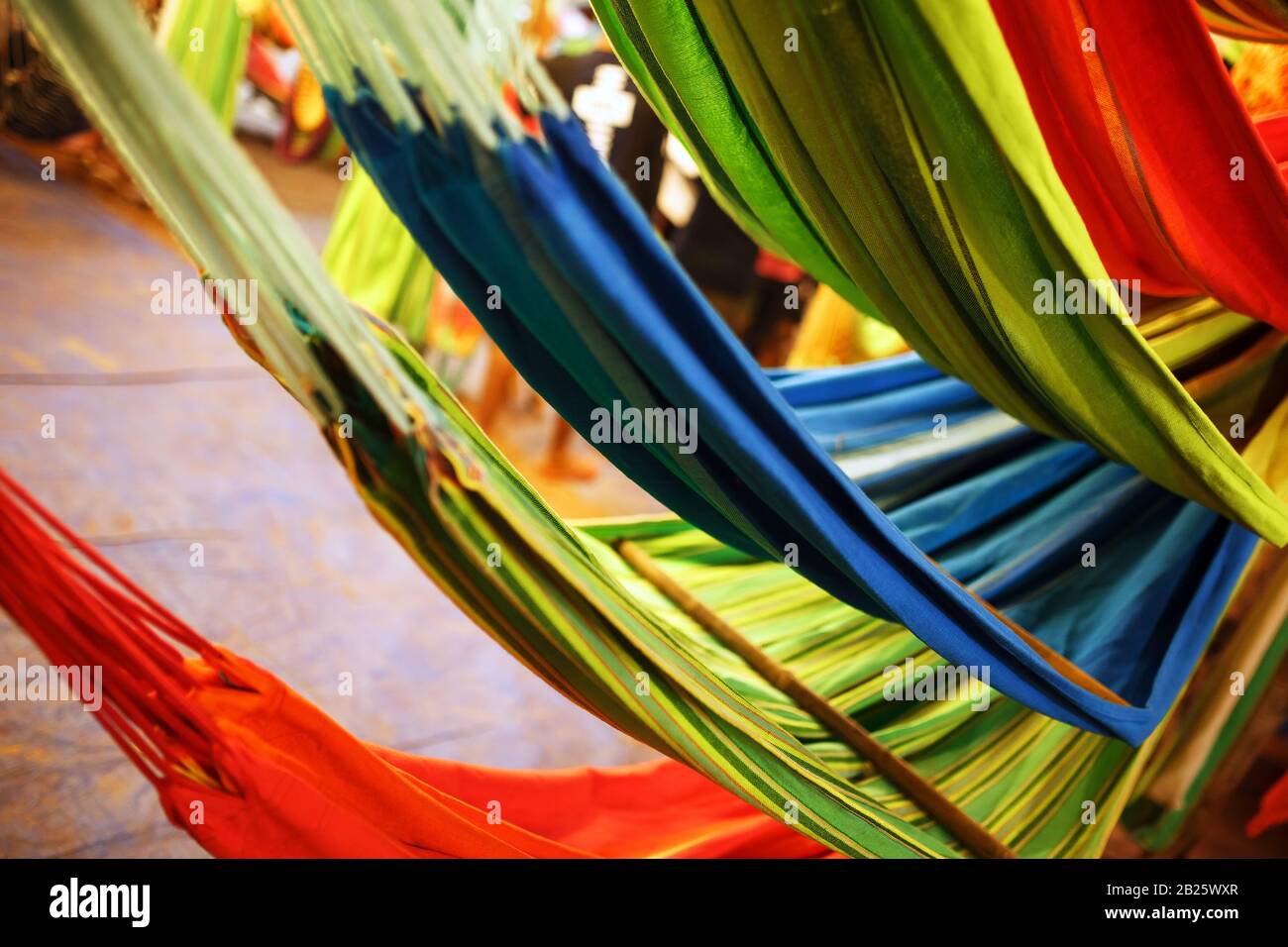 Hammocks of different colors, colors of the rainbow on the night market ...