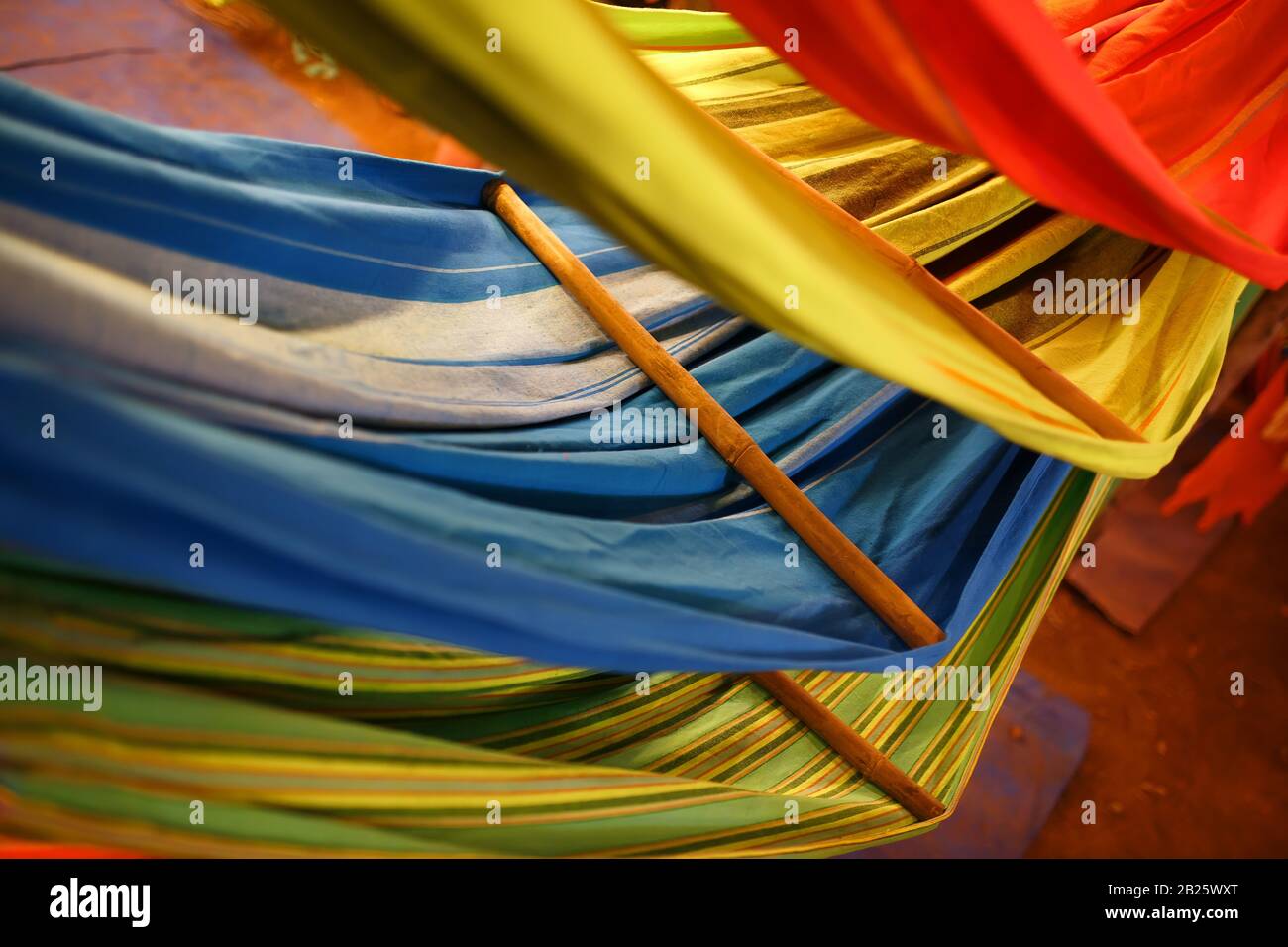 Hammocks of different colors, colors of the rainbow on the night market ...