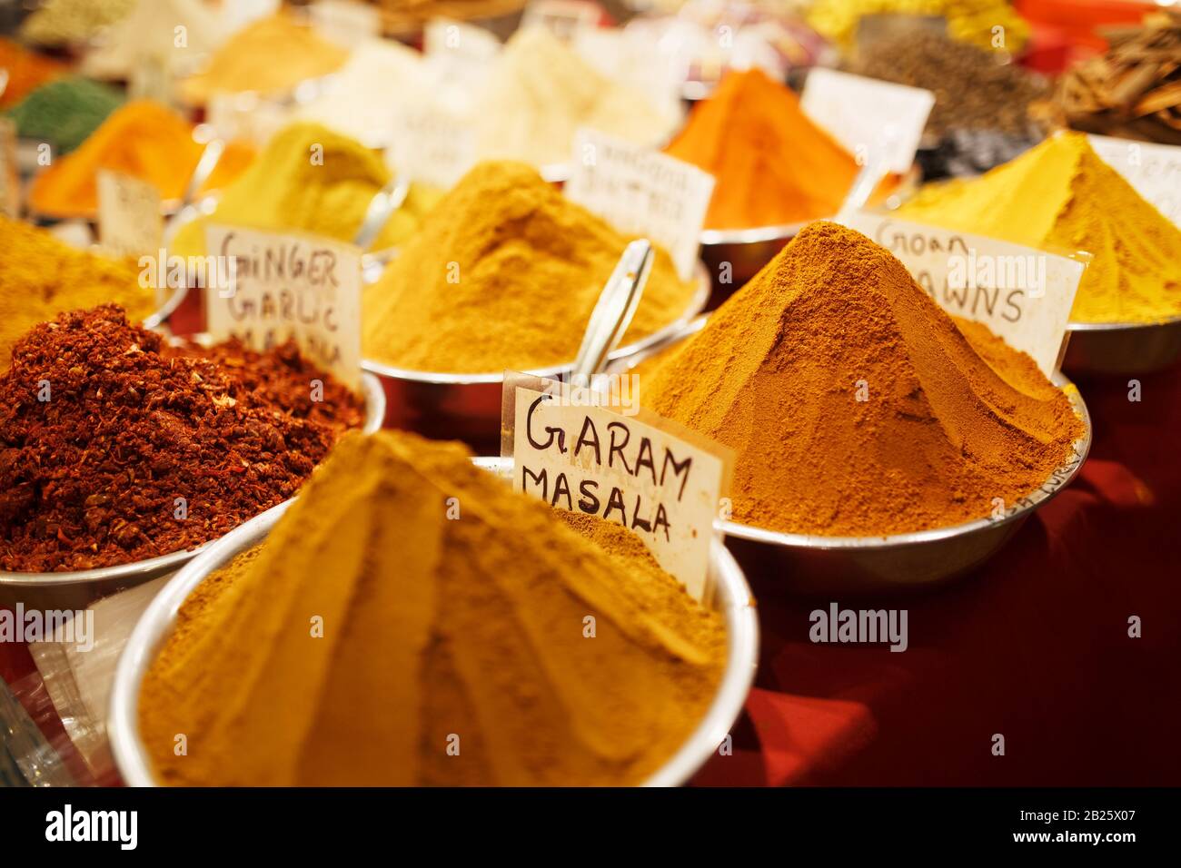 Colorful spices in bags at a market in Goa, Night market India Stock ...