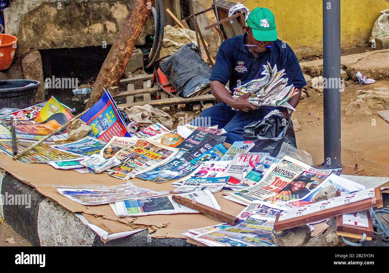 Newspaper vendor on a street in Lagos, Nigeria Stock Photo - Alamy
