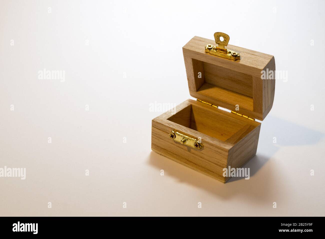 Small wooden box isolated on white background Stock Photo - Alamy
