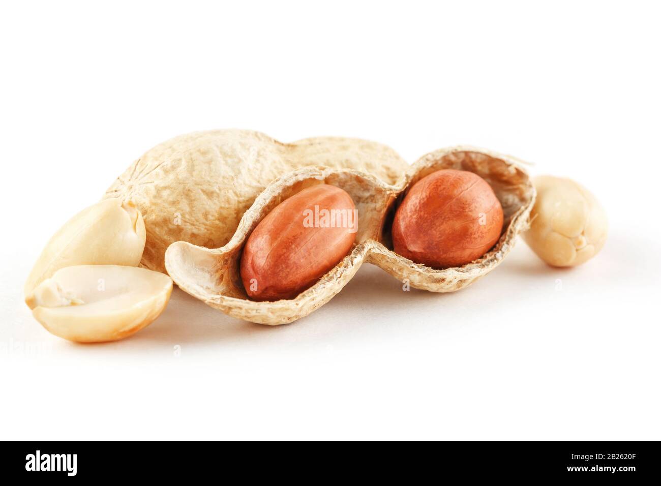 Peanuts closeup in shell and peeled on a white background. Growing ...