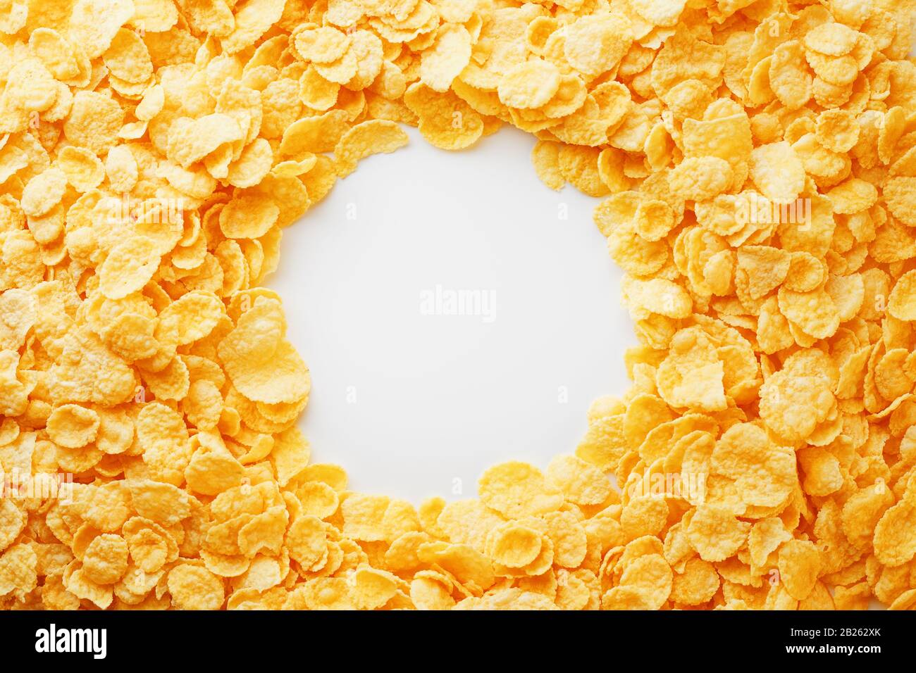 Golden Cornflakes full frame with empty round copy space in the middle ...
