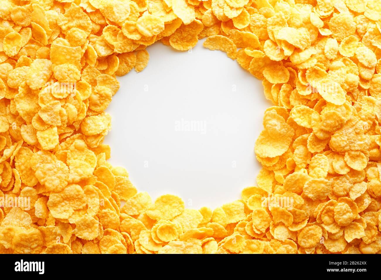 Golden Cornflakes full frame with empty round copy space in the middle ...