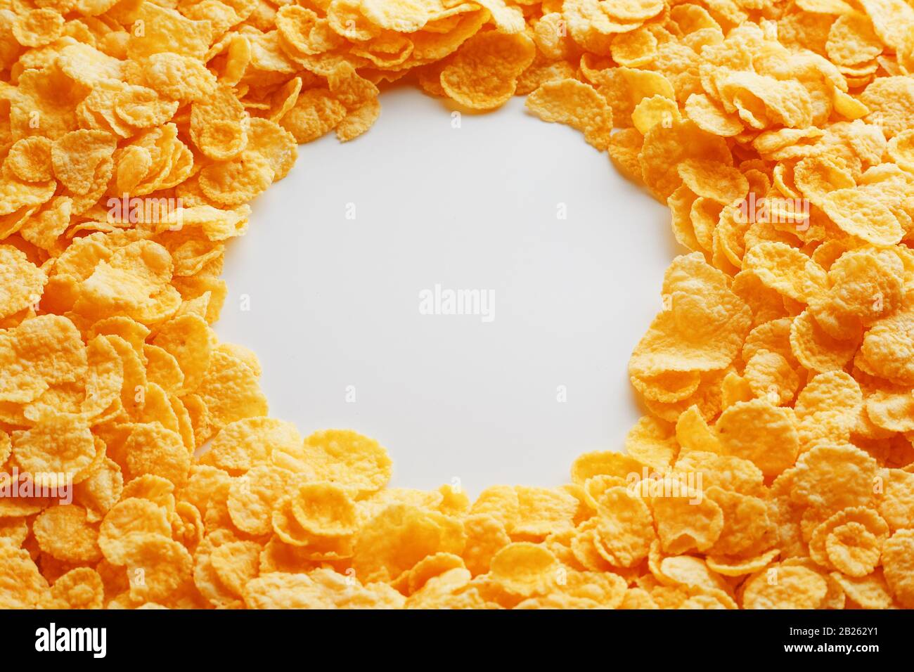 Golden Cornflakes full frame with empty round copy space in the middle ...