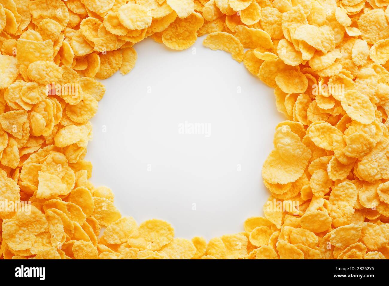Golden Cornflakes full frame with empty round copy space in the middle ...