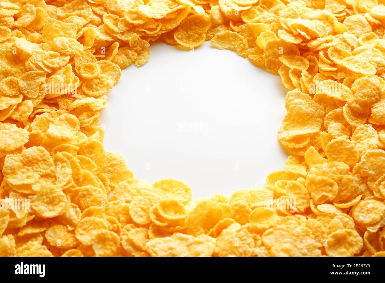 Golden Cornflakes full frame with empty round copy space in the middle ...