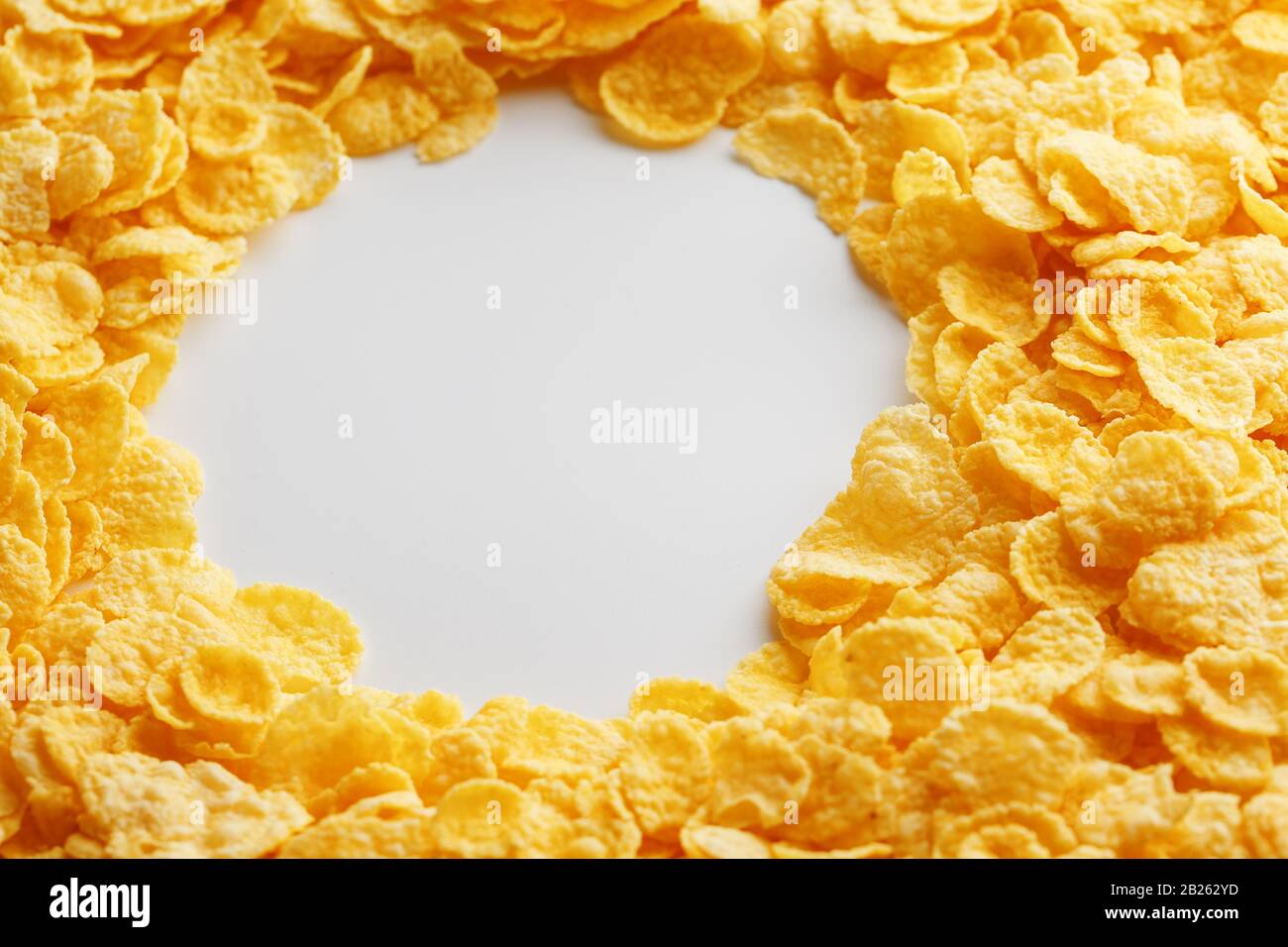 Golden Cornflakes full frame with empty round copy space in the middle ...