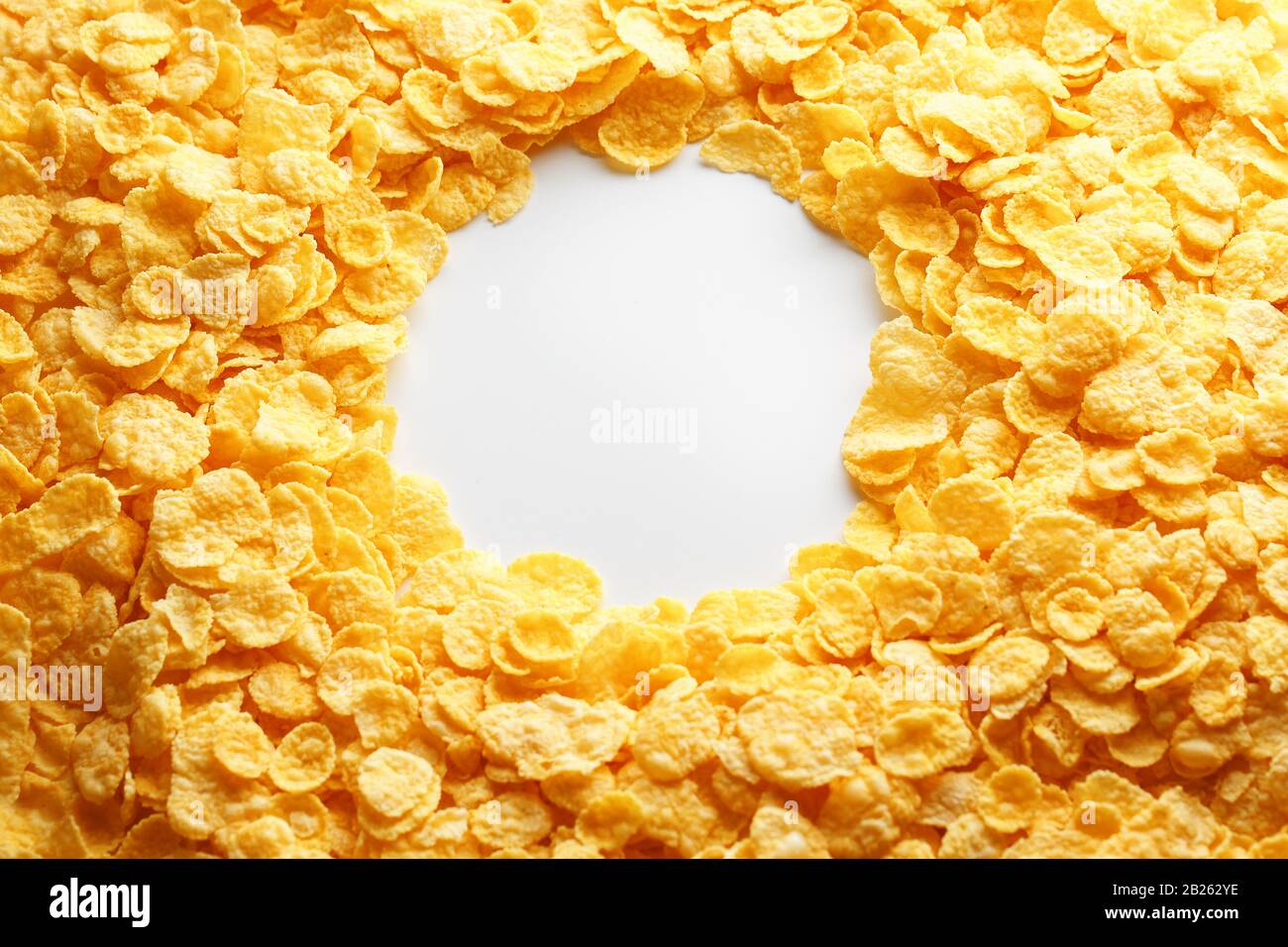 Golden Cornflakes full frame with empty round copy space in the middle ...