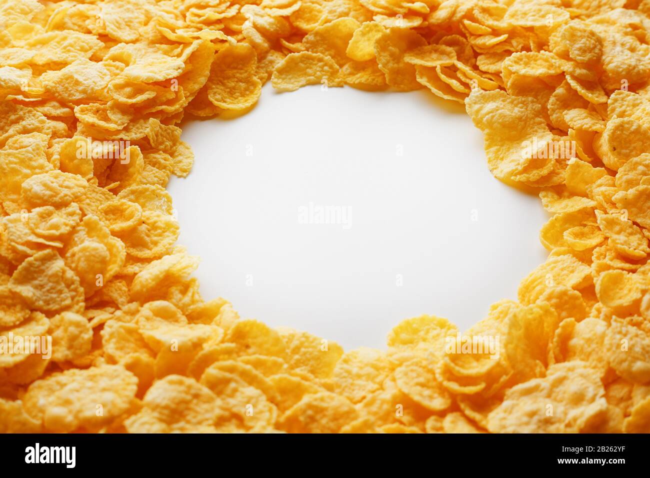 Golden Cornflakes full frame with empty round copy space in the middle ...