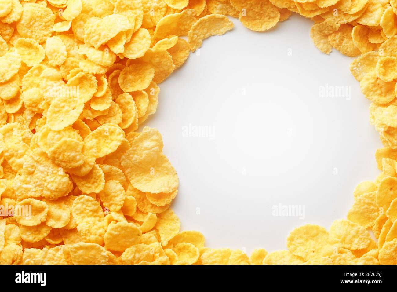 Golden Cornflakes full frame with empty round copy space in the middle ...