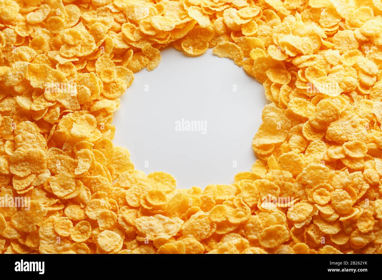 Golden Cornflakes full frame with empty round copy space in the middle ...