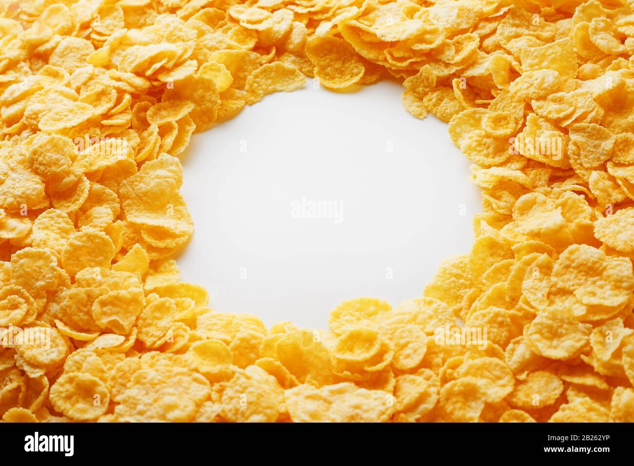 Golden Cornflakes full frame with empty round copy space in the middle ...