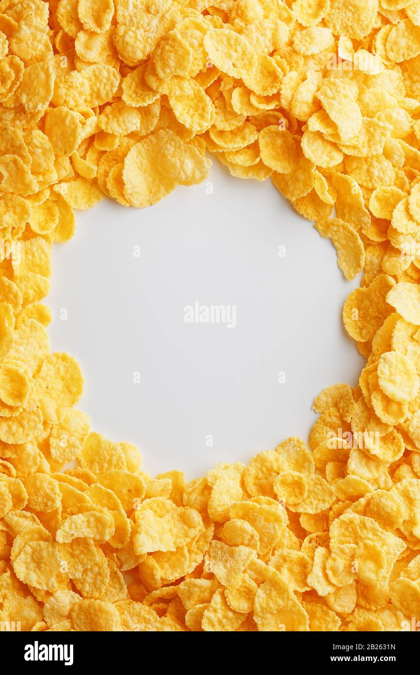 Golden Cornflakes full frame with empty round copy space in the middle ...