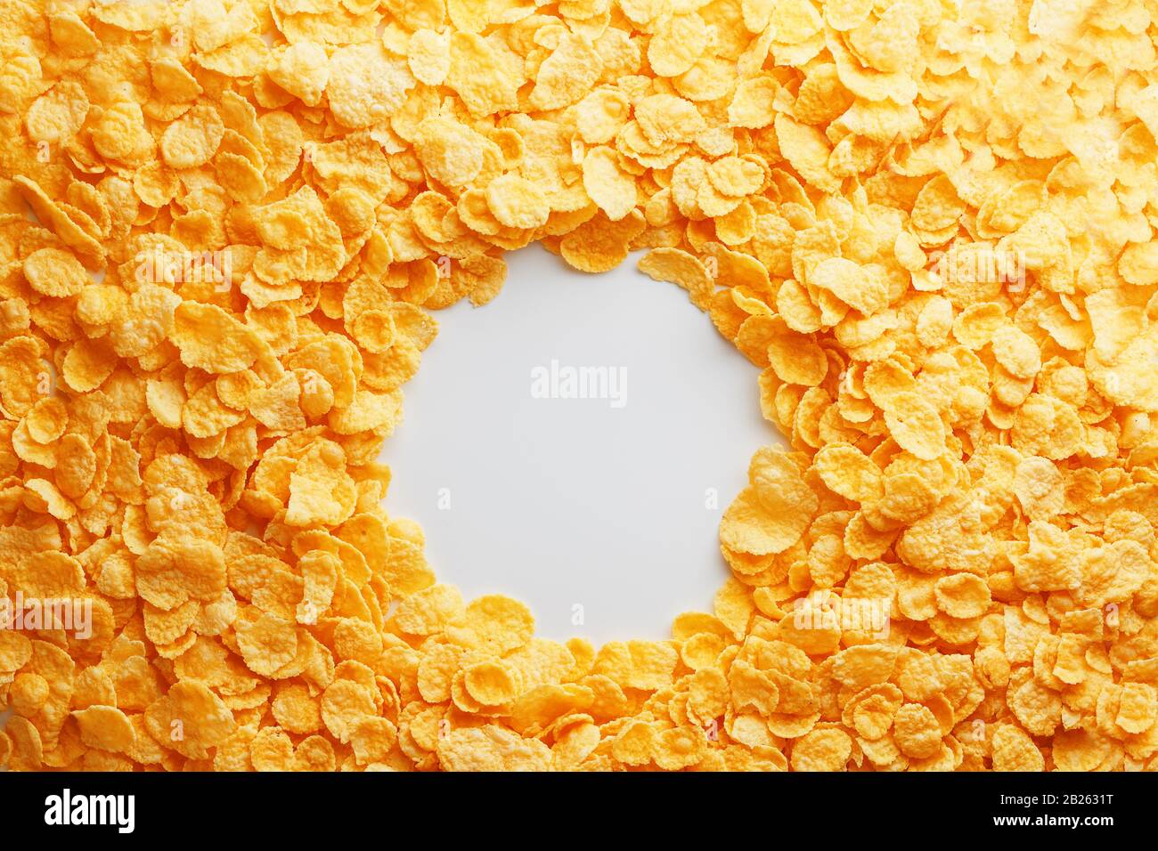 Golden Cornflakes full frame with empty round copy space in the middle ...