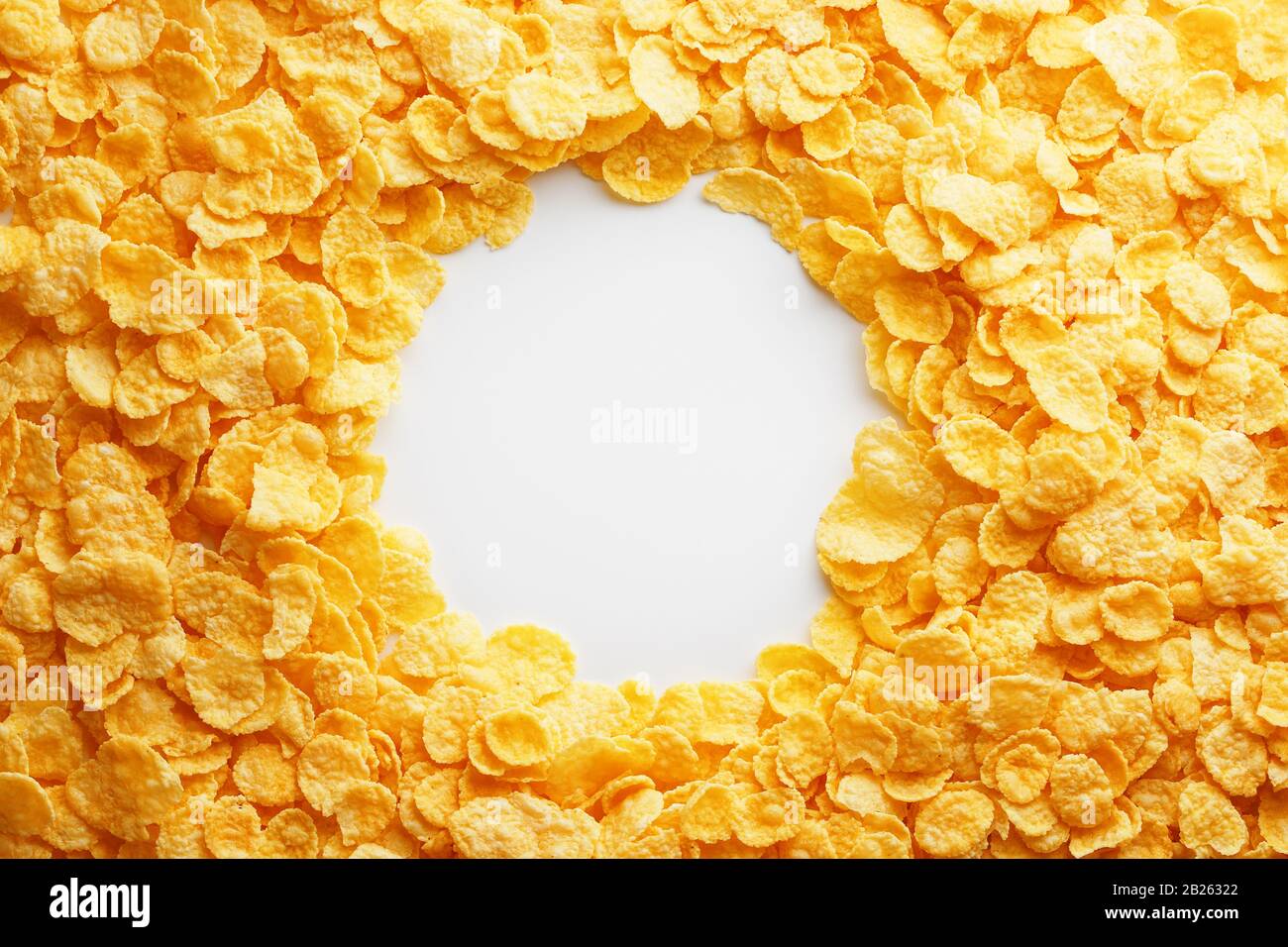 Golden Cornflakes full frame with empty round copy space in the middle ...