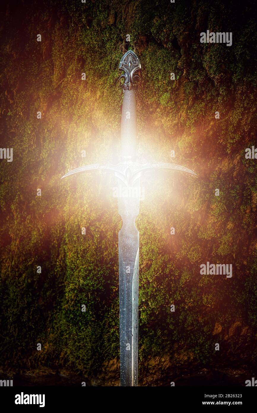 Magyc sword on moss background Stock Photo - Alamy