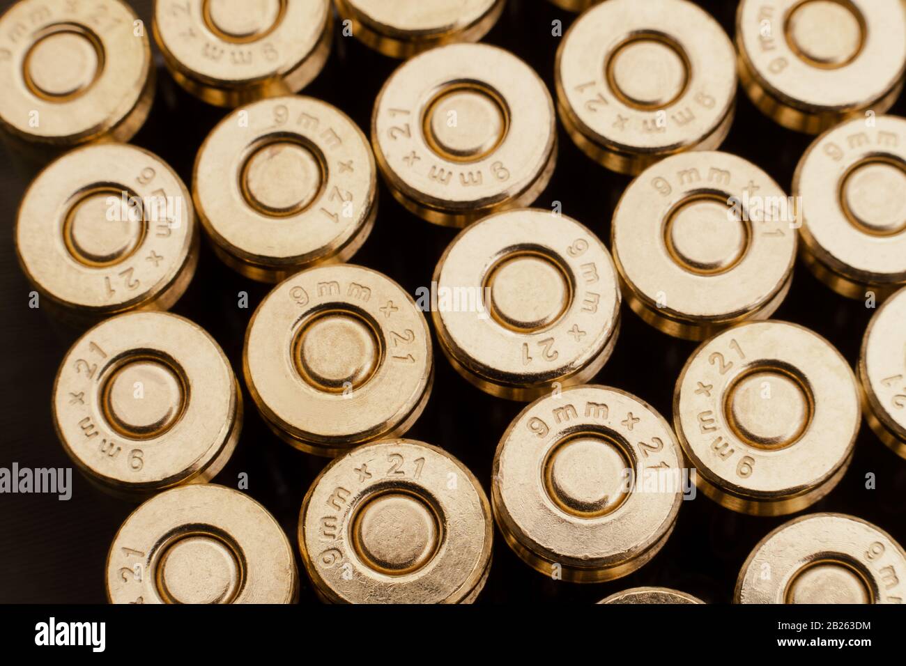 Close-up of a group of 9mm rounds. Cartridge background. New cartridges ...