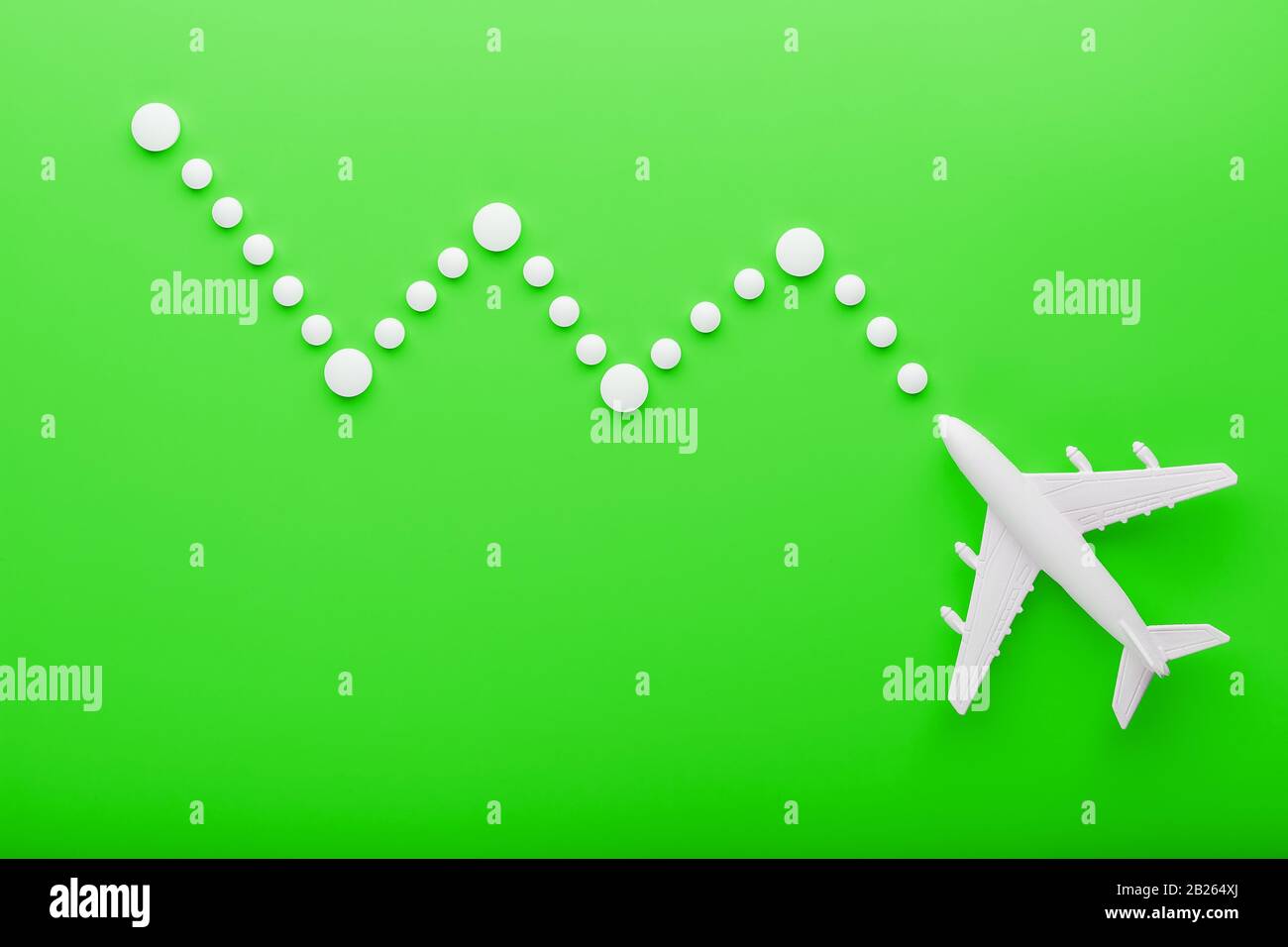 White passenger plane with trajectory points as on a route map ...