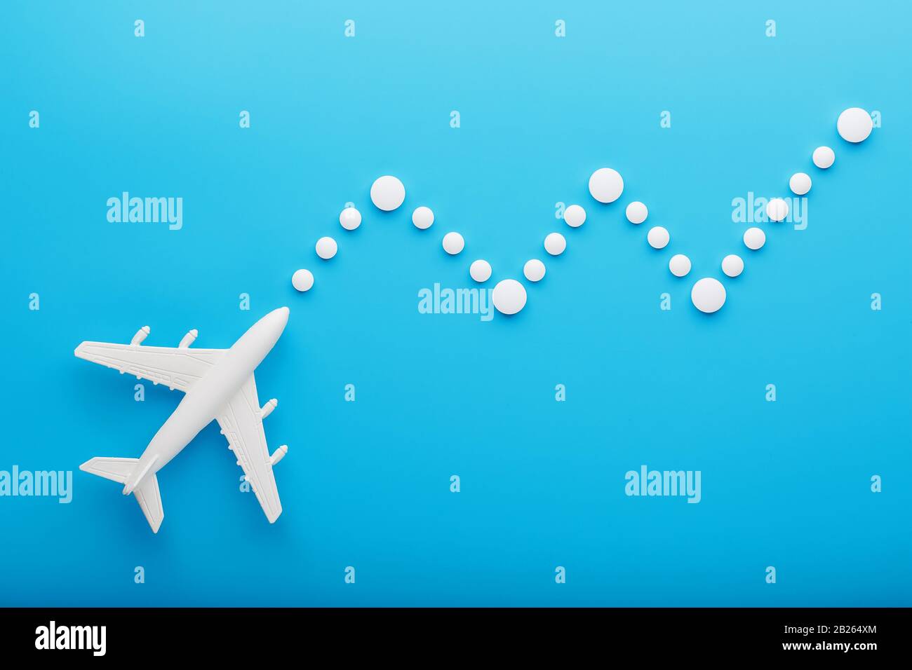 White model of a passenger plane with dotted trajectory points isolated ...