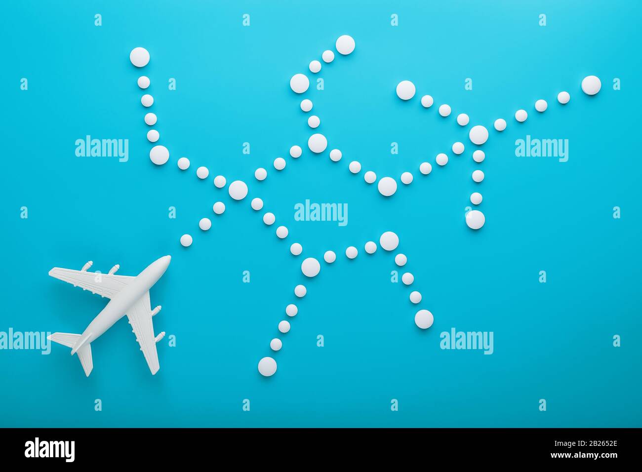 White model of a passenger plane with dotted trajectory points isolated ...