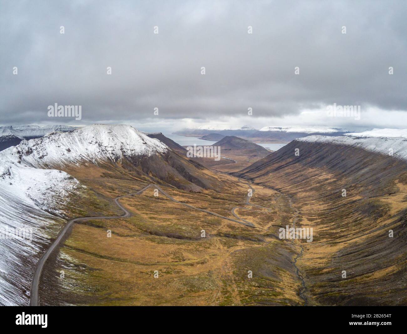 West fjords of Iceland aerial photo of mountain pass leading down in ...