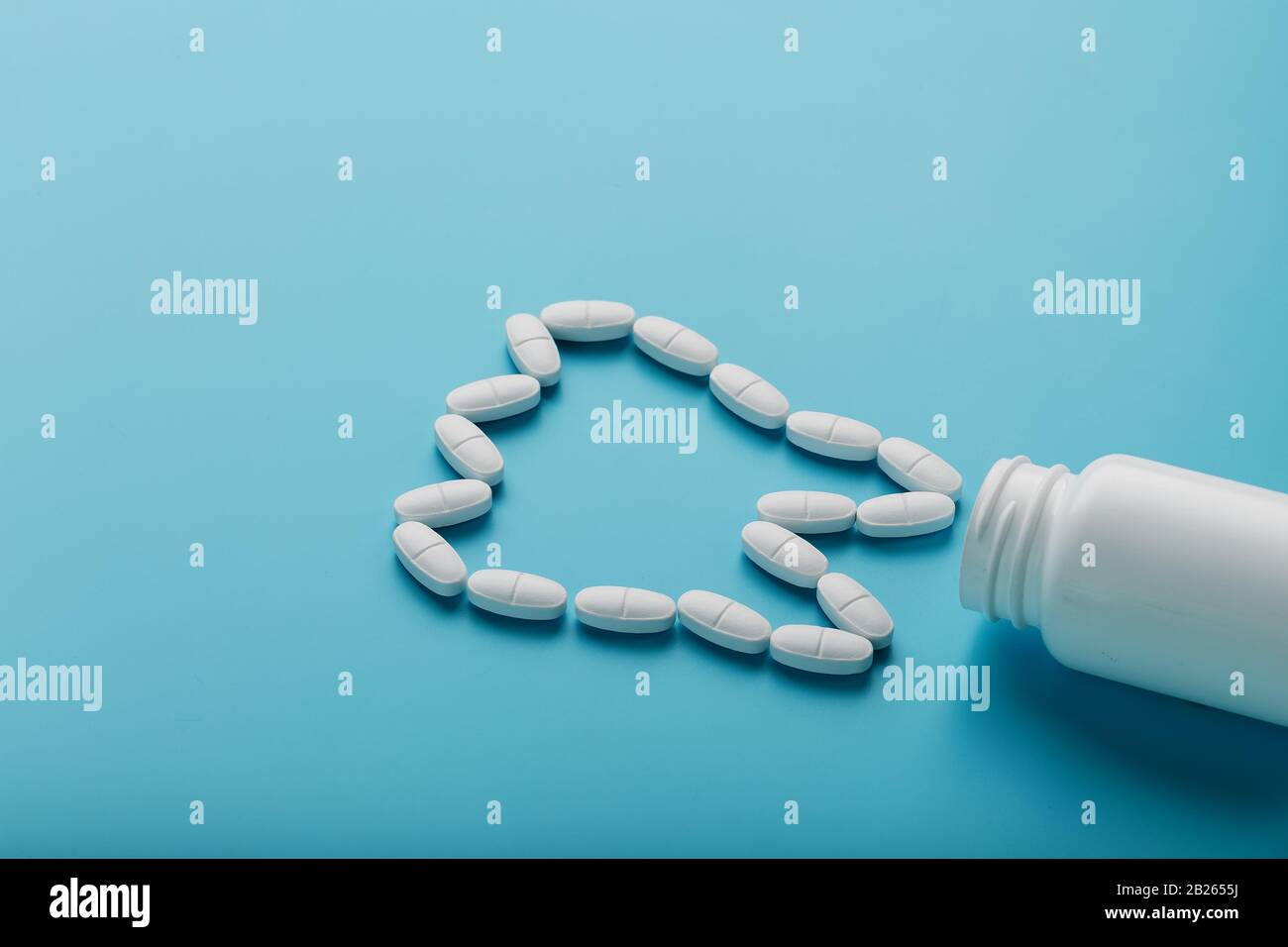 Vitamins with calcium Ca in the form of a tooth are scattered from a ...