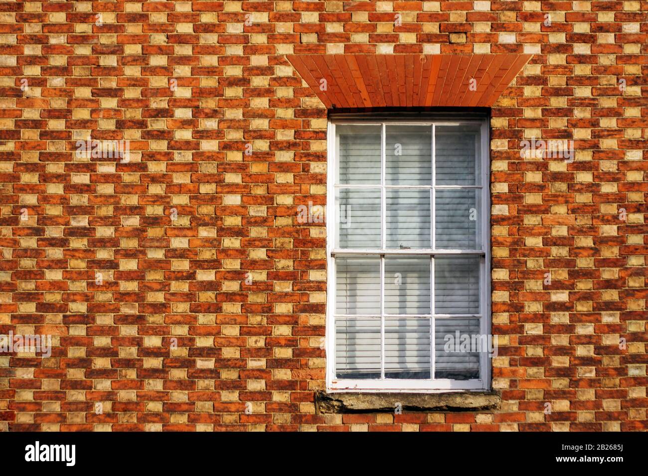 old window on brick wall building texture in england uk Stock Photo - Alamy