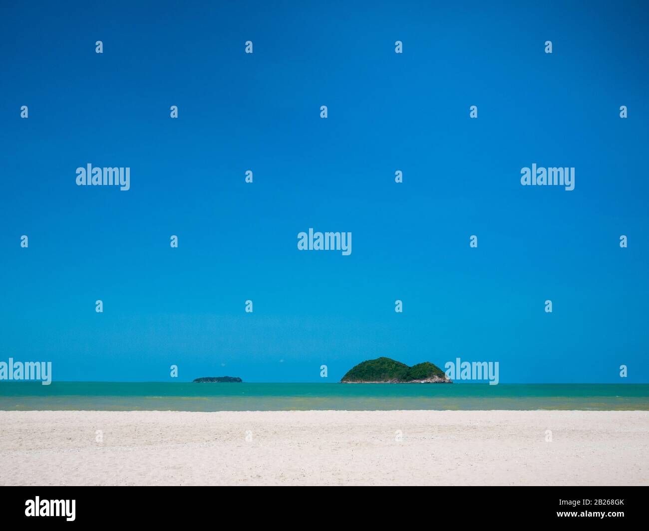 White sand beach with clear blue sky without cloud over sea and two ...