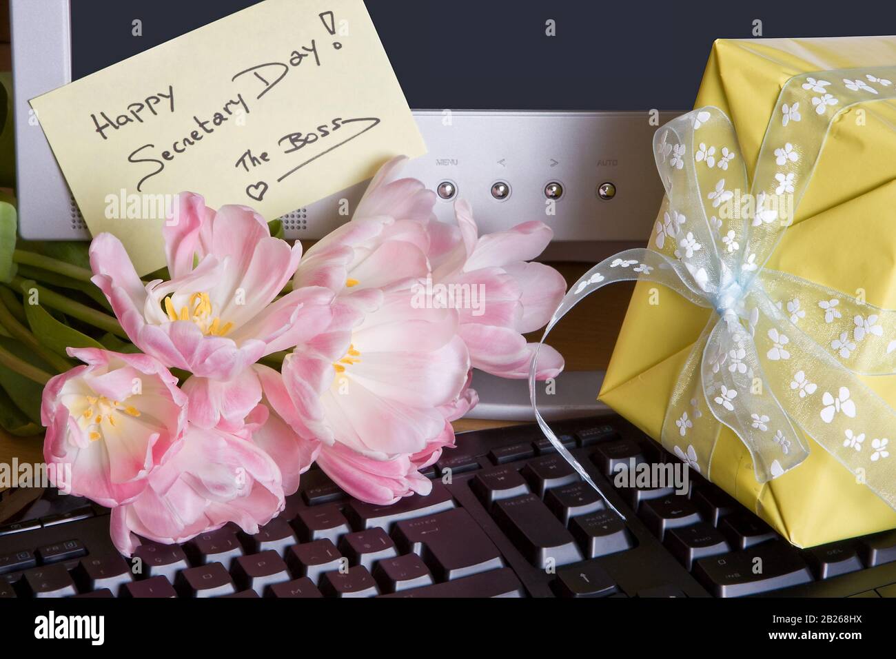Gift and flowers from the boss on secretary's day Stock Photo - Alamy