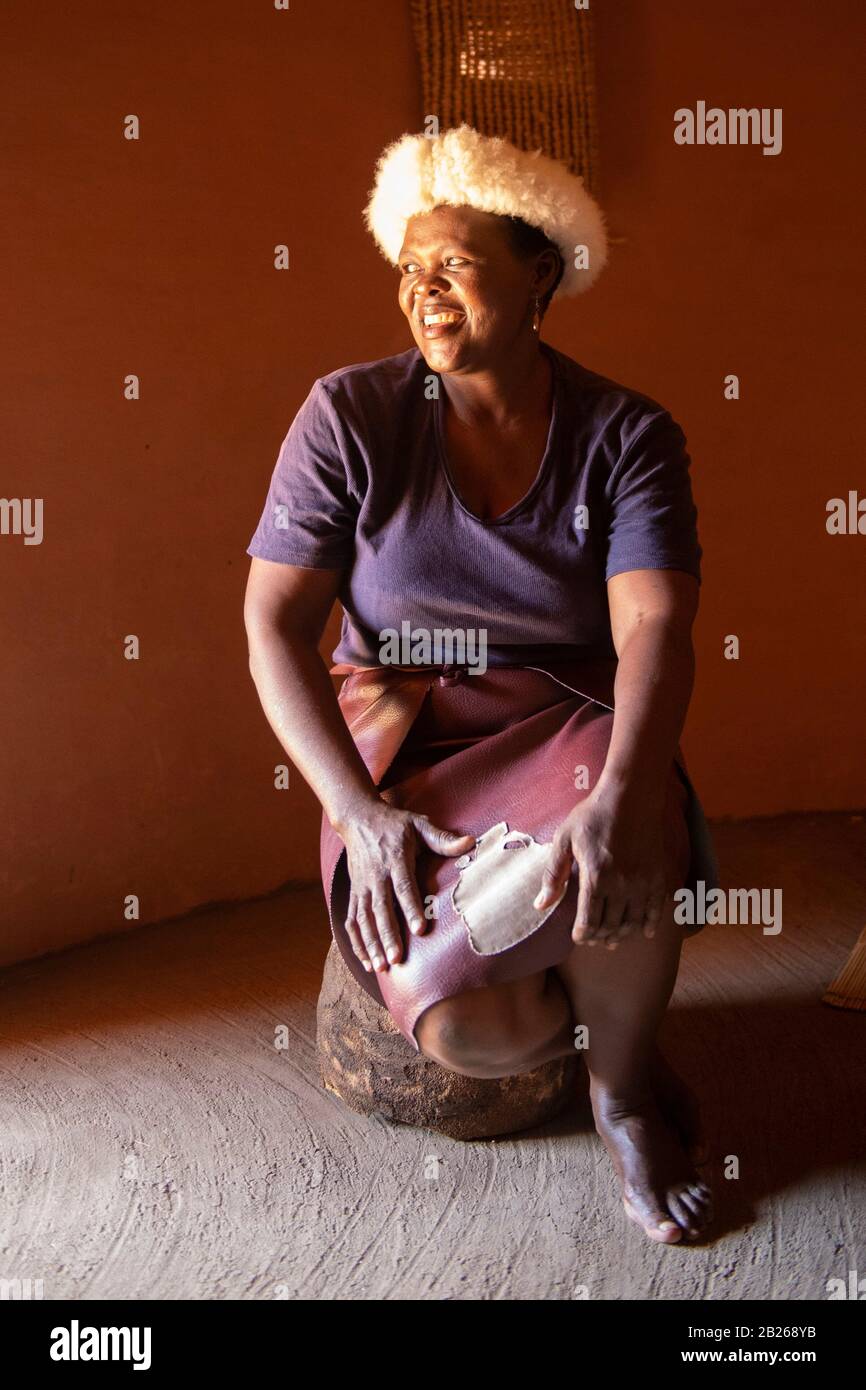 Basotho woman in a traditional hut, Thaba Bosiu Cultural Village ...