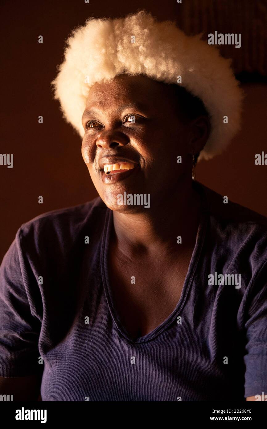 Basotho woman in a traditional hut, Thaba Bosiu Cultural Village ...