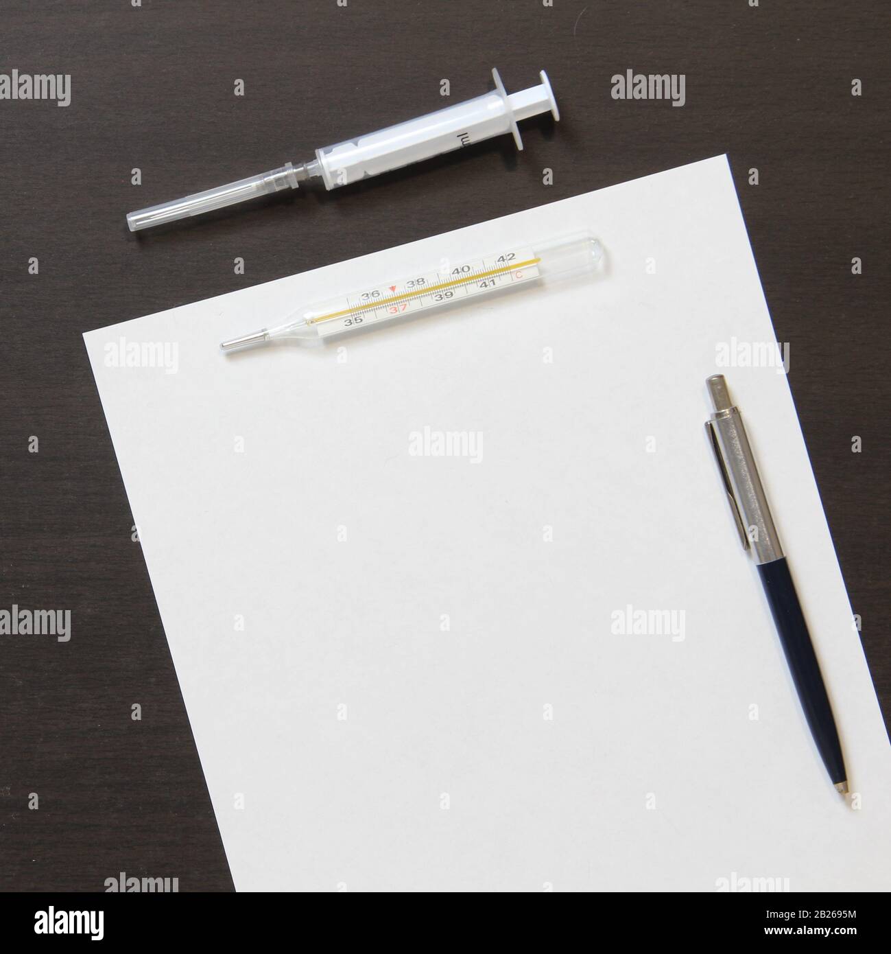 Template of white paper with pen, thermometer and syringe for injection ...