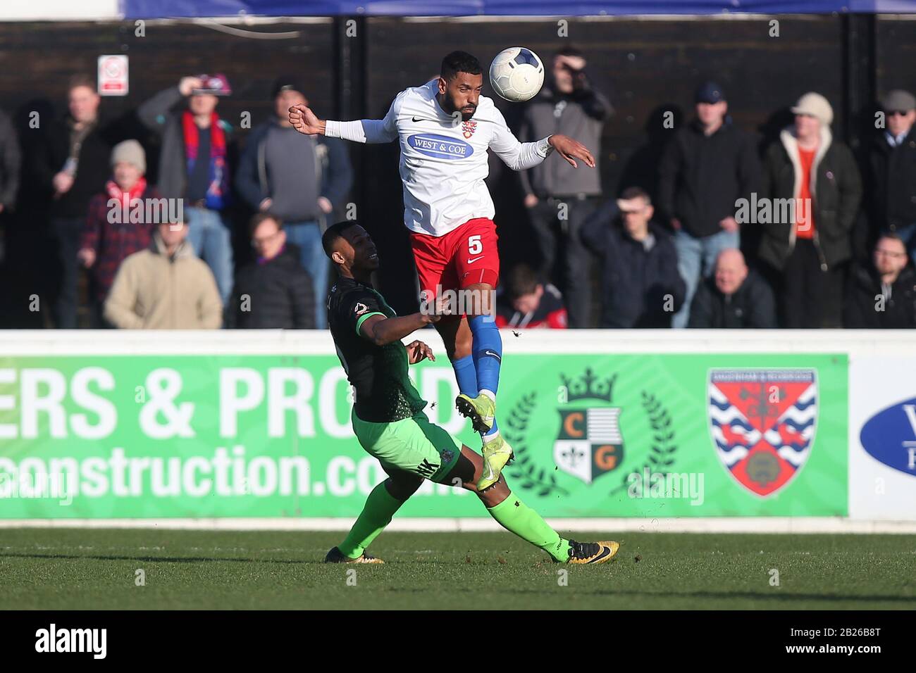Luke Croll of Dagenham and Nyal Bell of Stockport during Dagenham ...