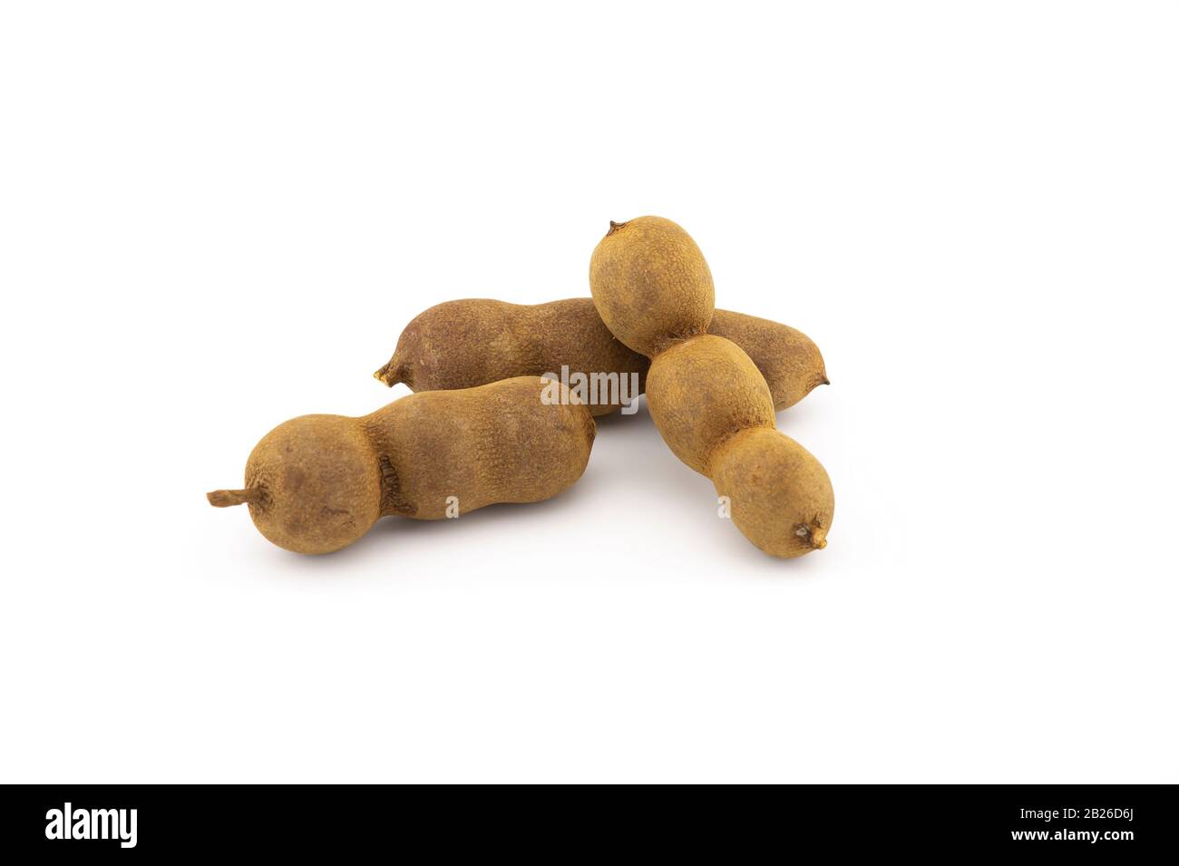 Sweet whole tamarind fruits isolated on white background Stock Photo ...